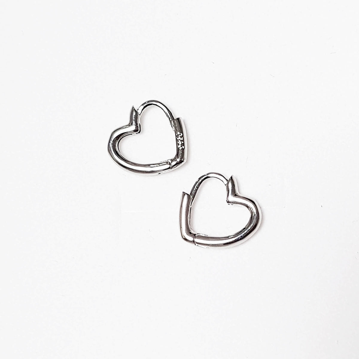 Tiny Minimal Heart huggies. Heart hoops Small, Dana Mantzur– The Lady Bride